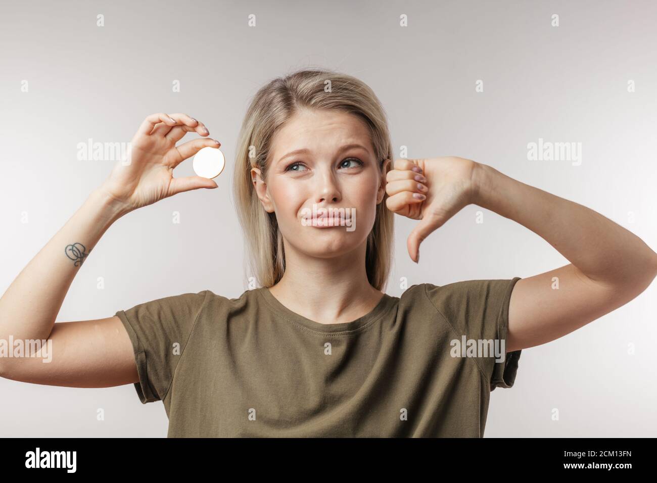 Human emotions and gestures concept. Attractive young woman with blonde ...