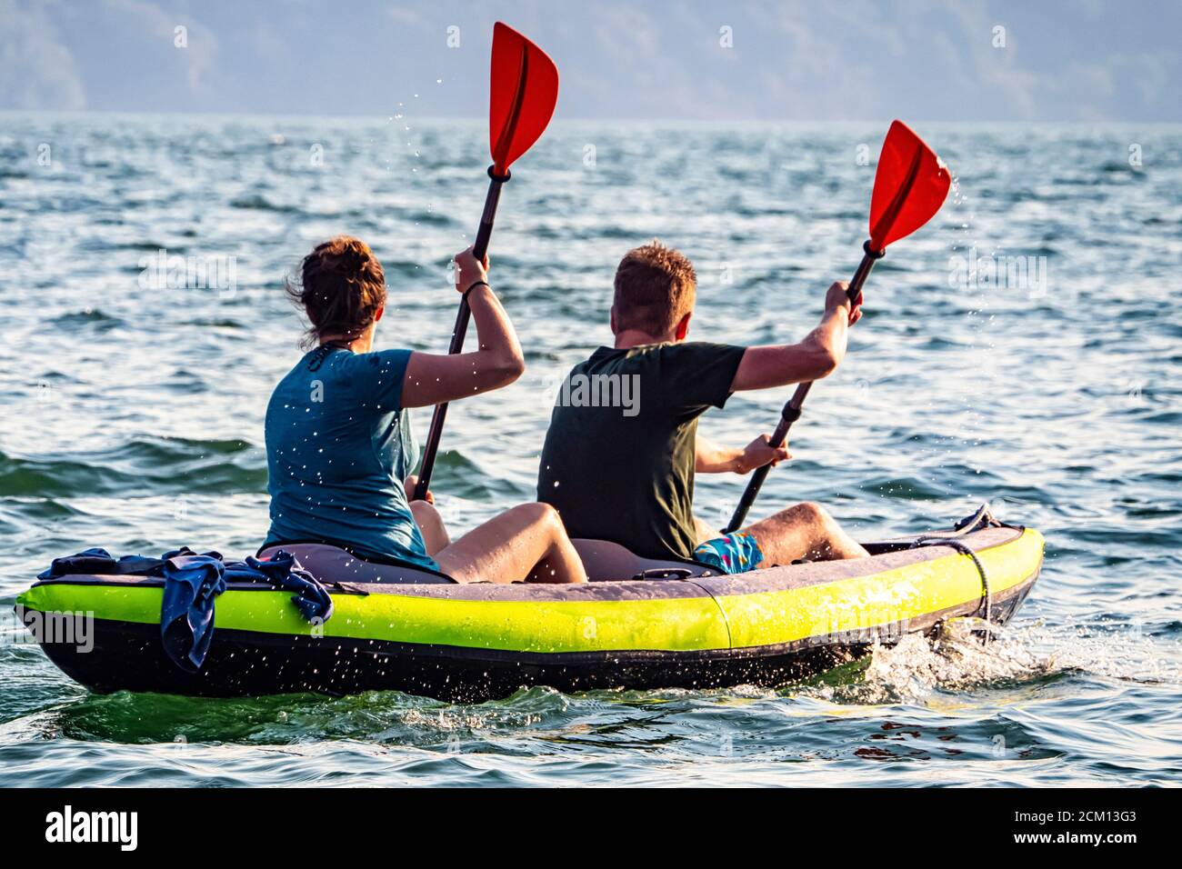Canoeing scene on Lake Como Stock Photo - Alamy