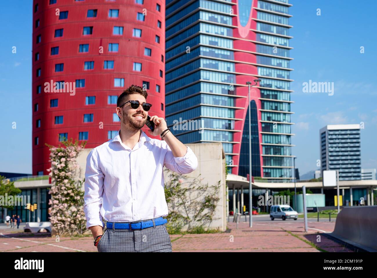 Handsome guy smiling using hi-res stock photography and images - Alamy