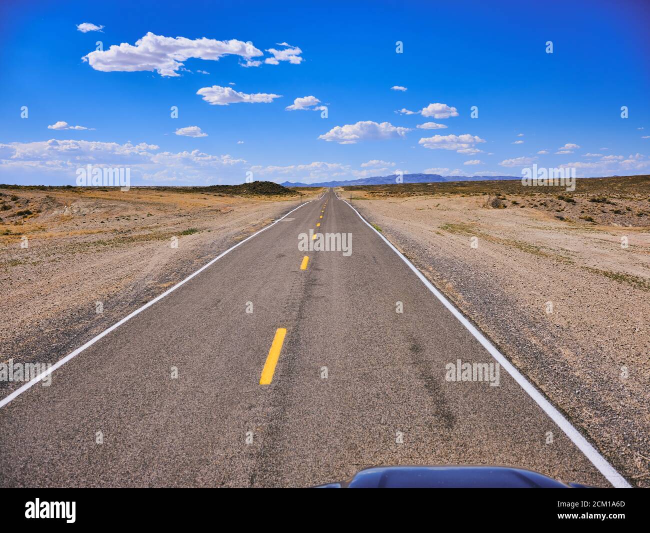 An empty desert highway calls for a road trip Stock Photo - Alamy