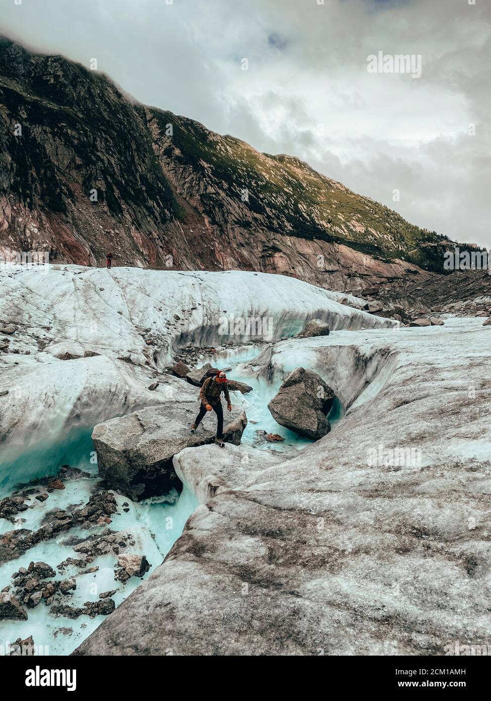 Climber stepping over rock hi-res stock photography and images - Alamy