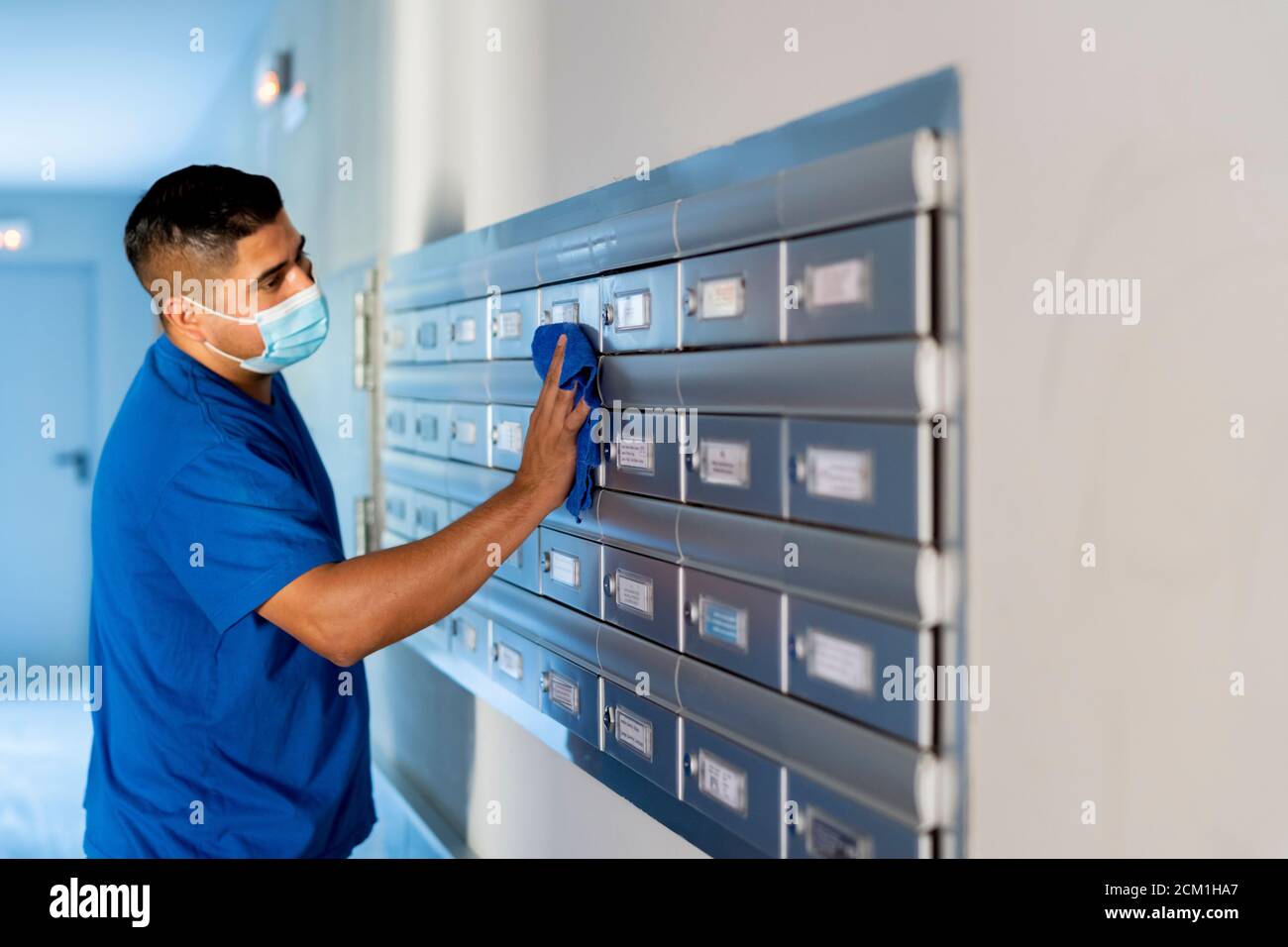 maintenance personnel disinfecting mailboxes to avoid covid19 Stock ...