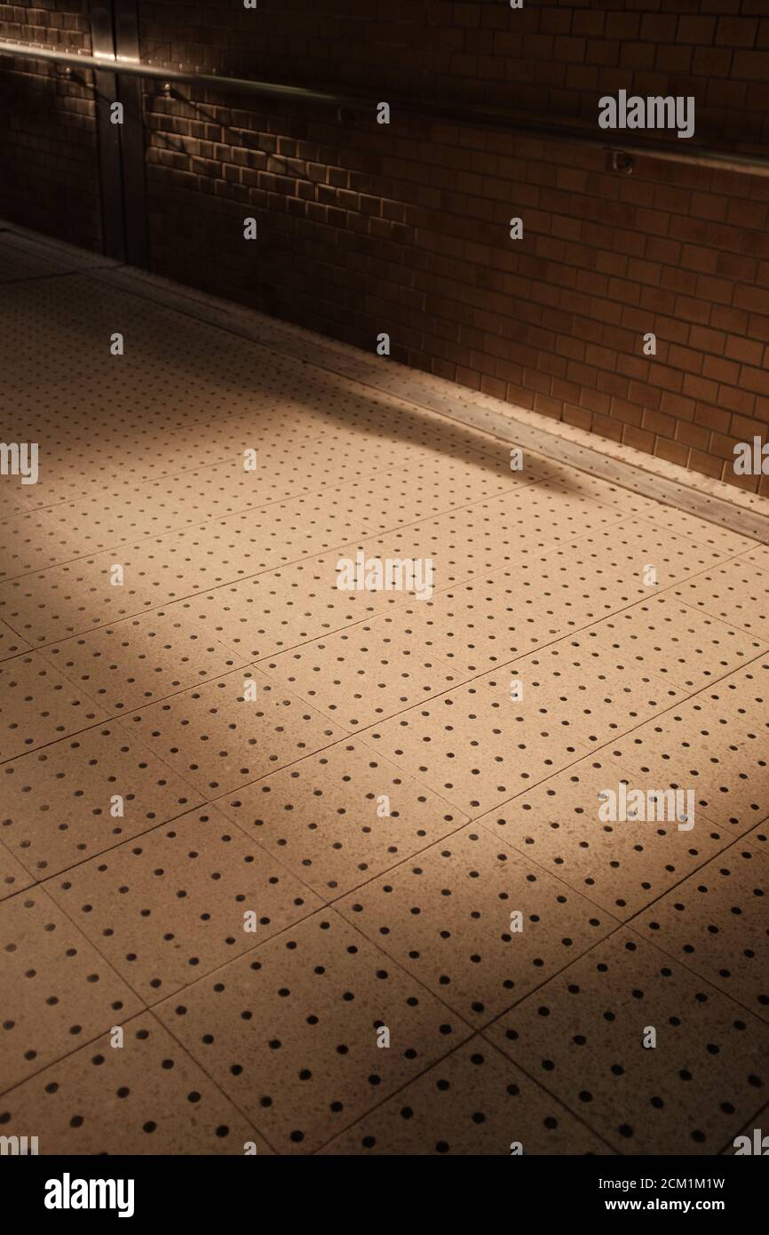 Vertical shot of shadows on a brick wall and tiled ground Stock Photo ...