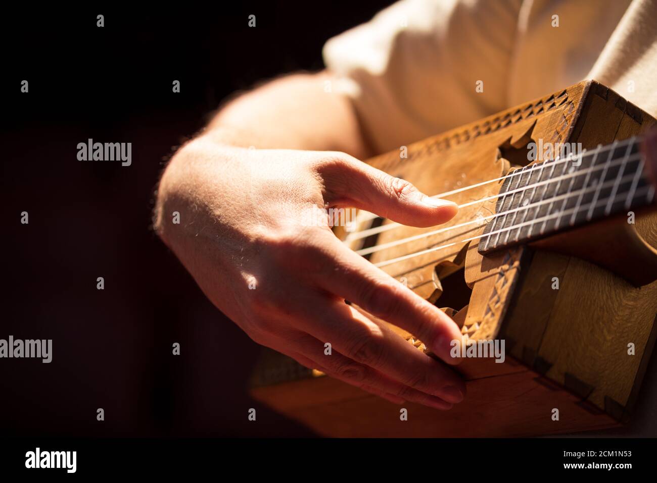 Close up male fingers of guitarist strumming the strings Stock Photo ...
