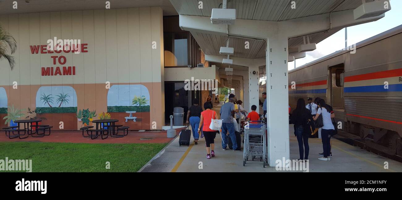 Welcome to Miami. Train travelers depart a train at Miami Train Station ...