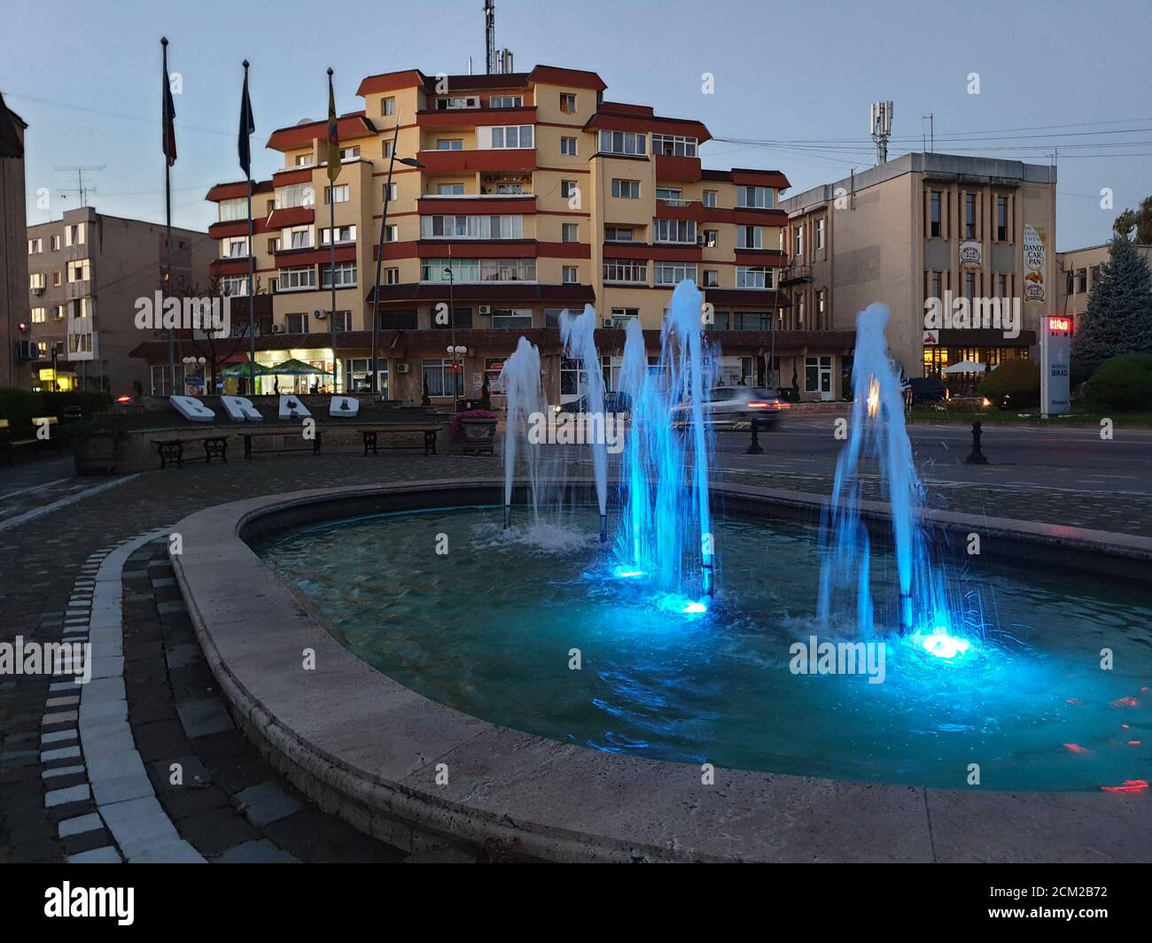 Brad town center water fountain in the evening. Summer at dusk water ...