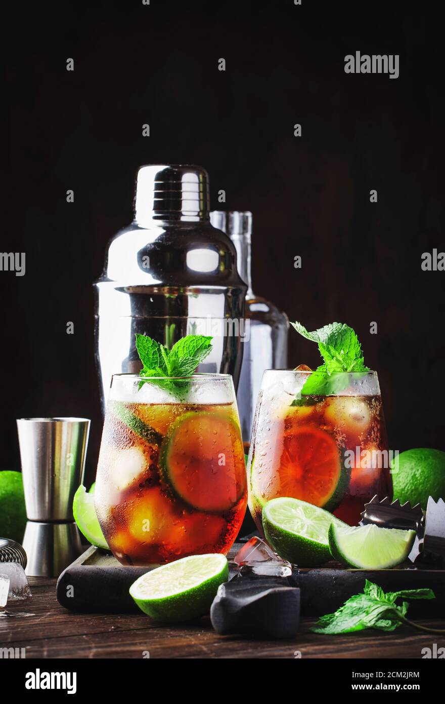 Cuba libre alcohol cocktail with golden rum, lemon juice, cola, lime ...