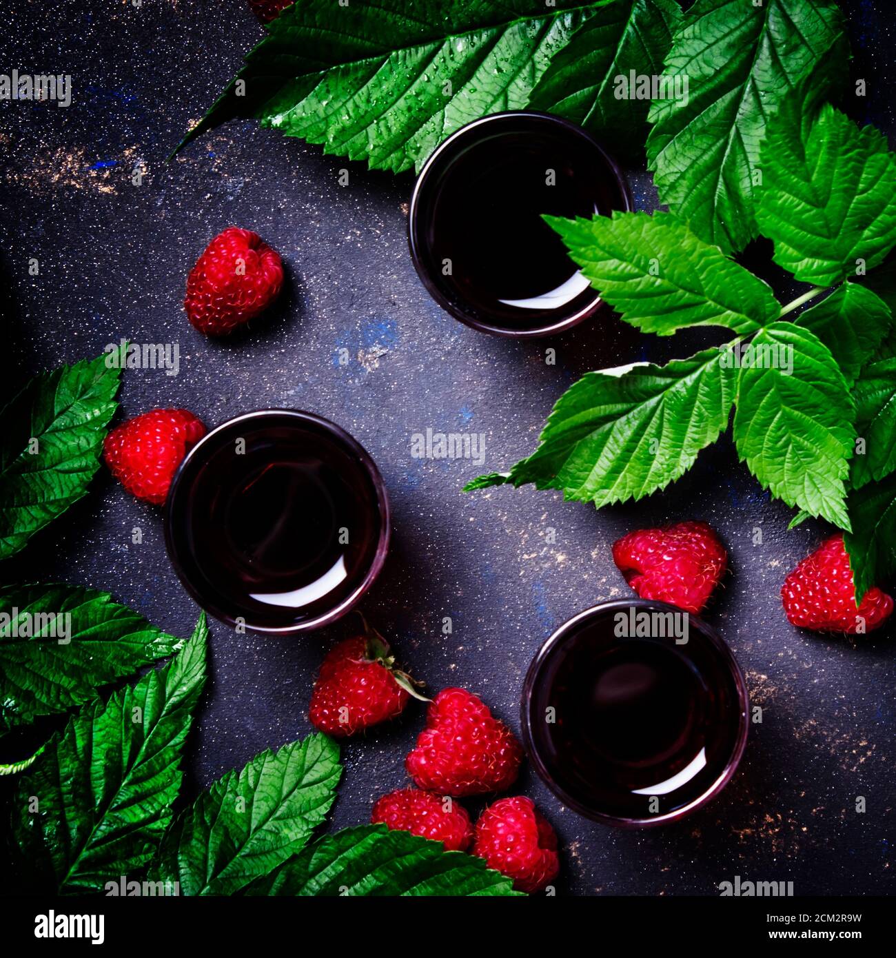 Raspberry drink, black background, top view Stock Photo - Alamy