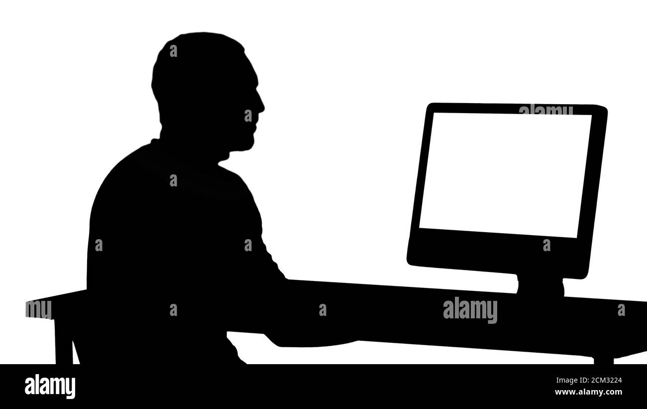 Silhouette Businessman working with a computer Stock Photo - Alamy