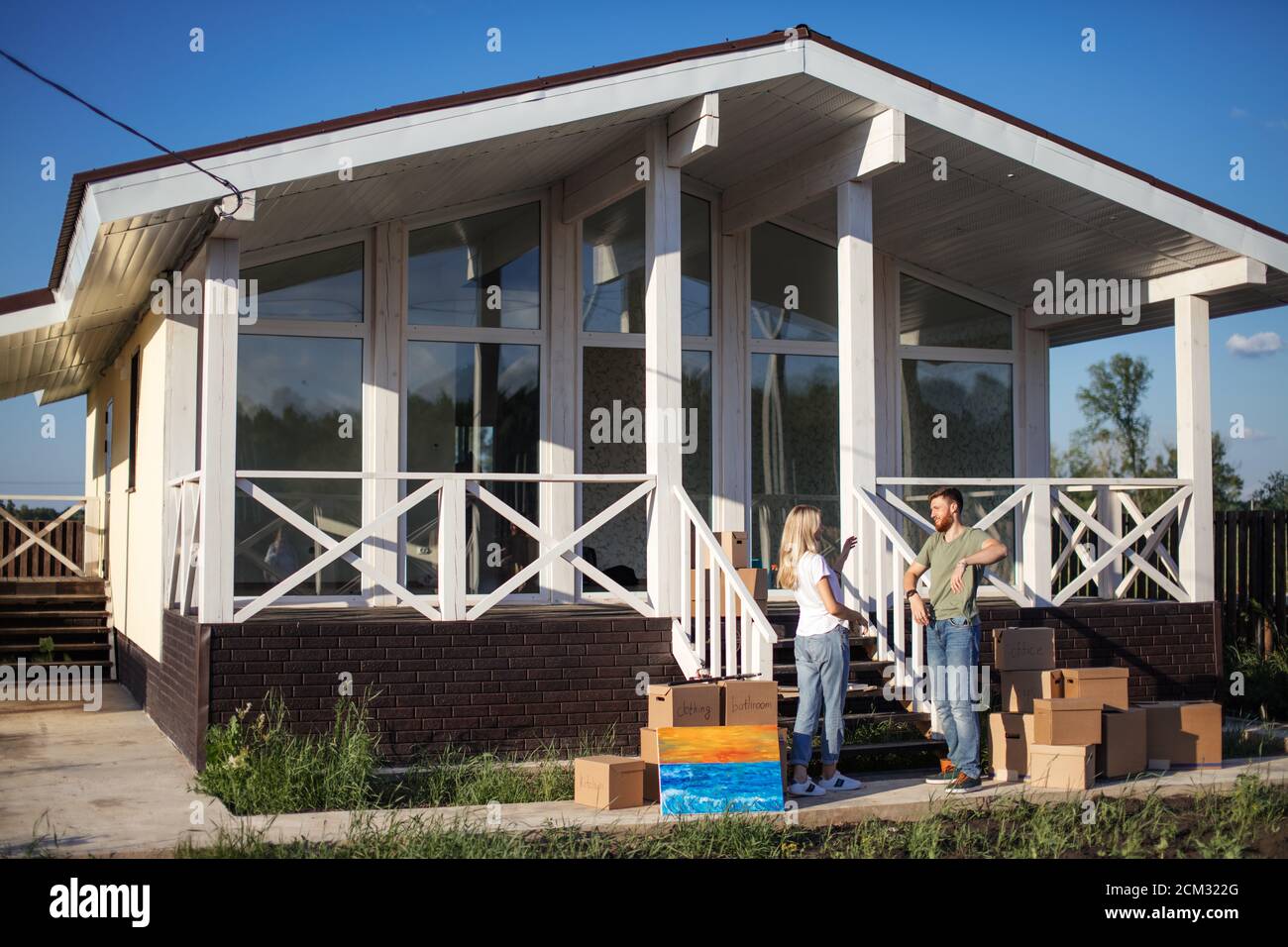 our first home swith new home owners on step Stock Photo - Alamy
