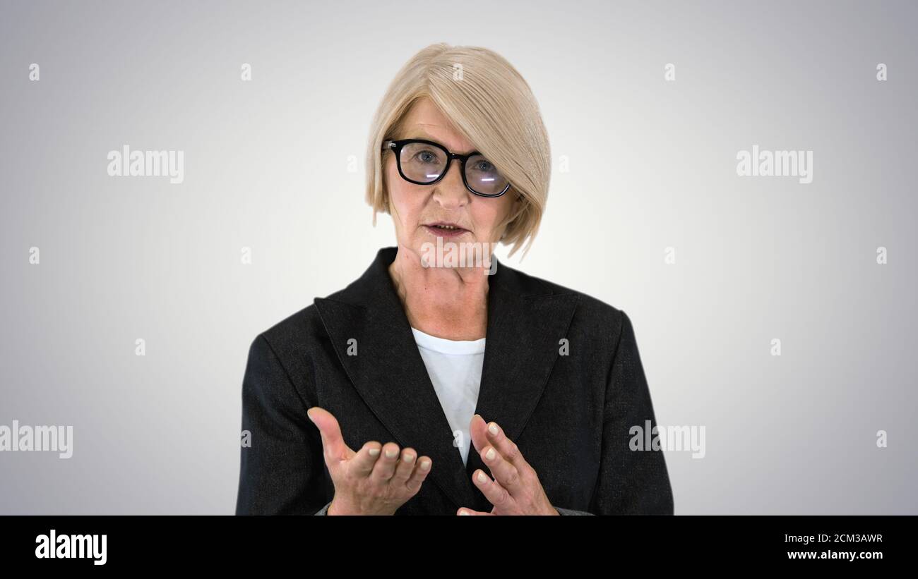 Senior businesswoman executive teacher looking at camera talking Stock ...