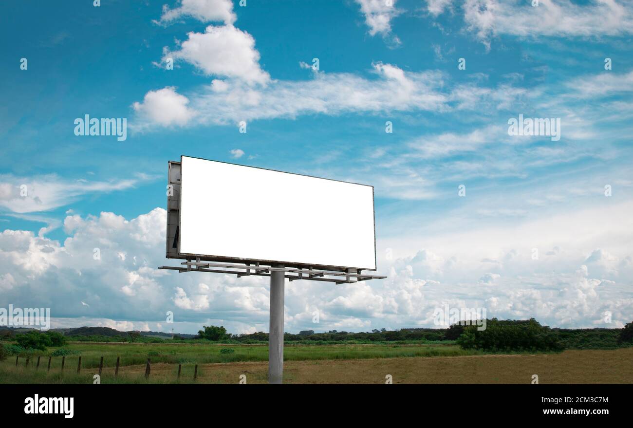 Billboard - Empty billboard in front of beautiful cloudy sky in a rural ...