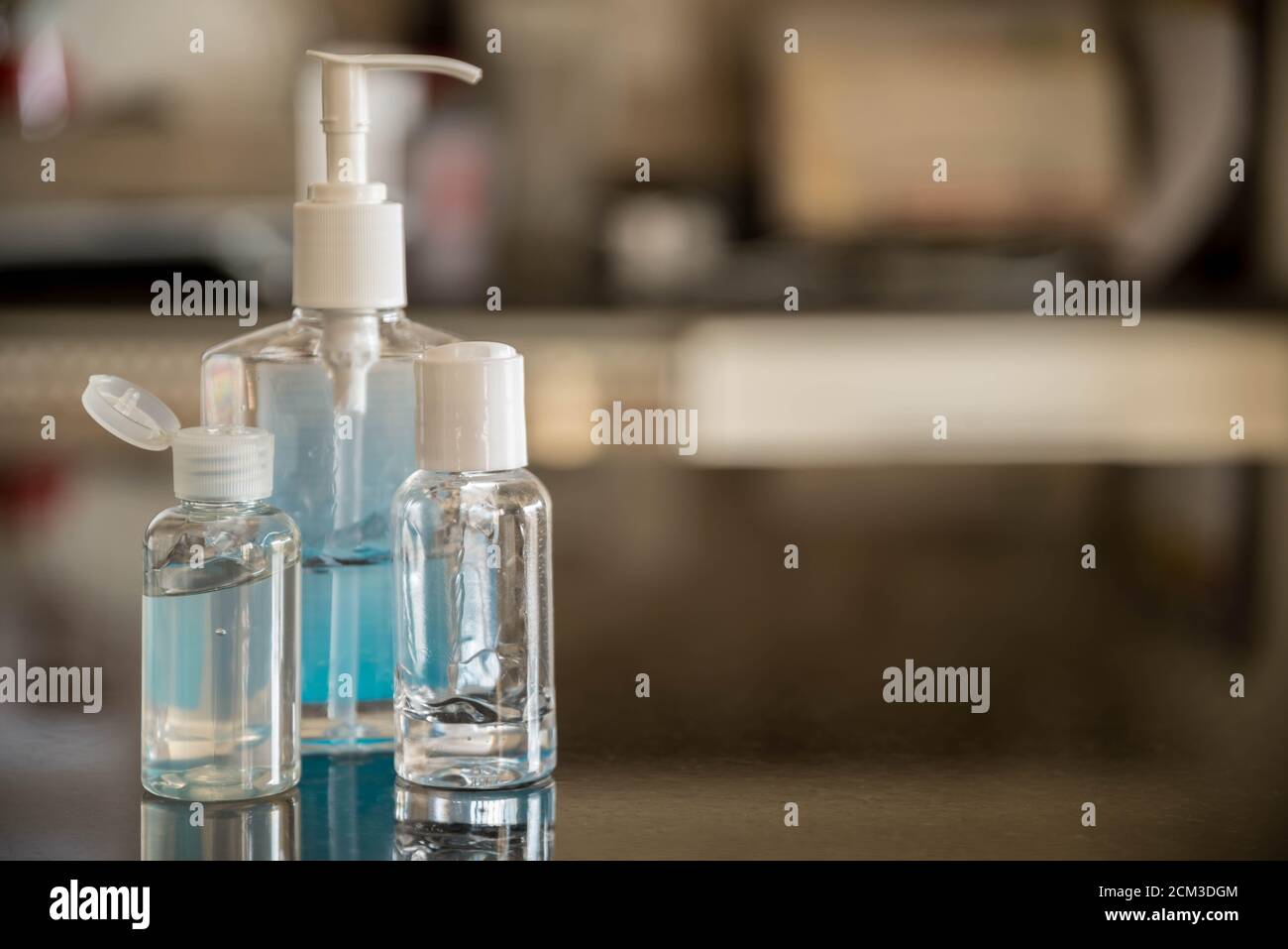 Different shapes of hand sanitizer bottles with blurry back ground ...