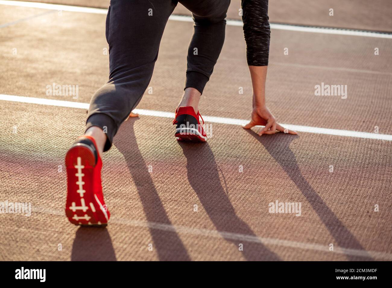 Stadium man sprinter preparing start hi-res stock photography and ...