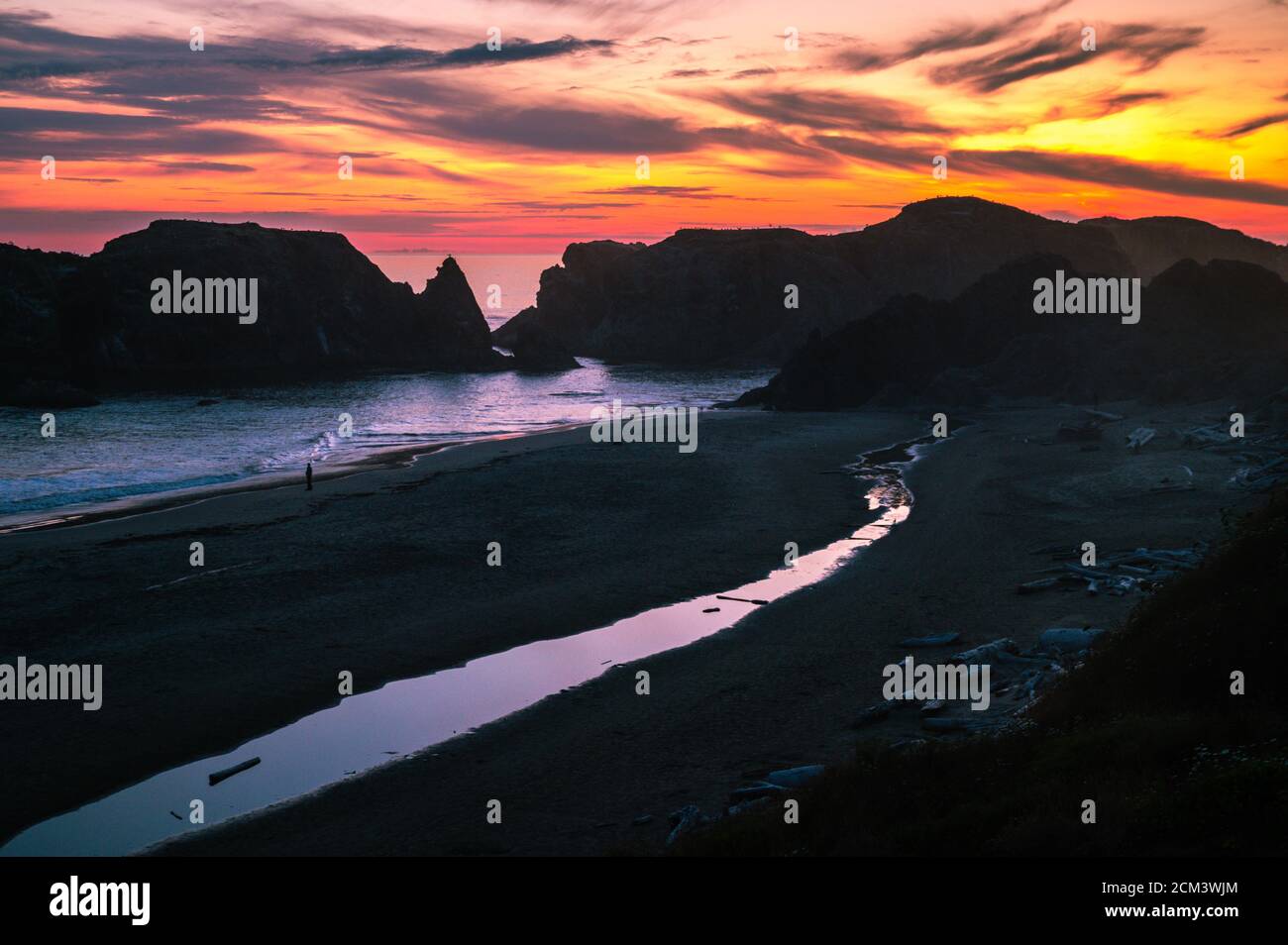 Colorful sunset over beach in Oregon Stock Photo - Alamy