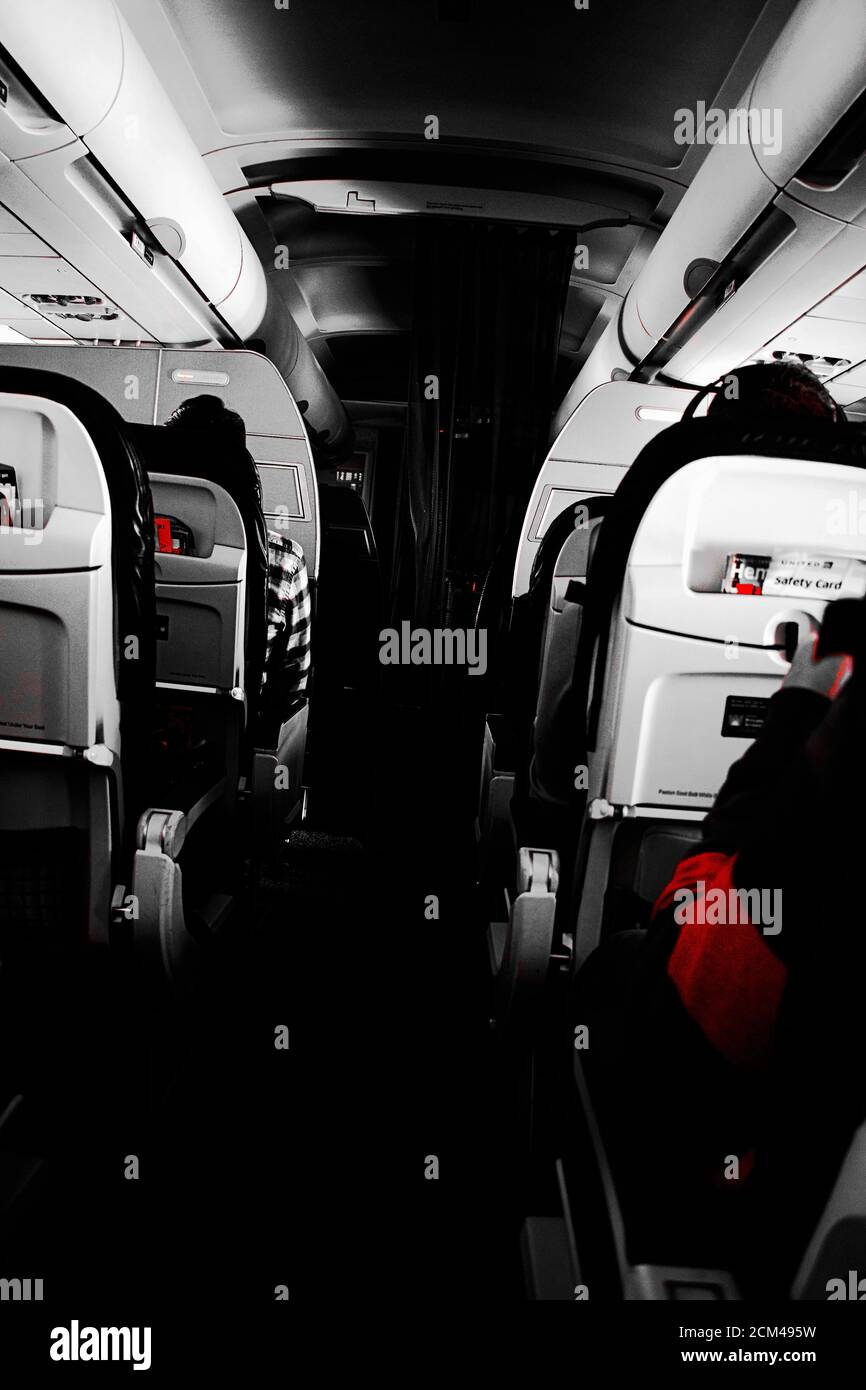 Cramped airplane seating hi-res stock photography and images - Alamy