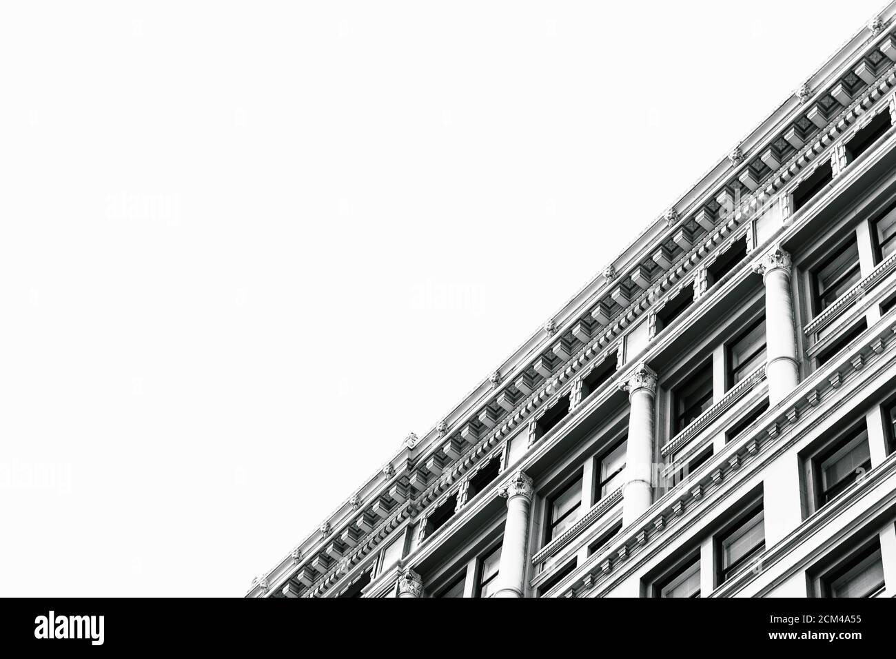 Minimalist corner view of the top of a historic office building in San ...