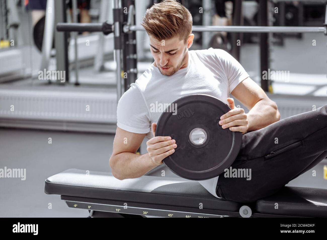 Modern gym guy sitting down hi-res stock photography and images - Alamy