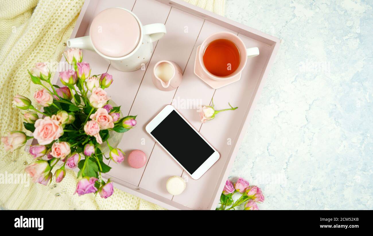 Blush pink theme cosy hygge desktop workspace with keyboard smart phone ...