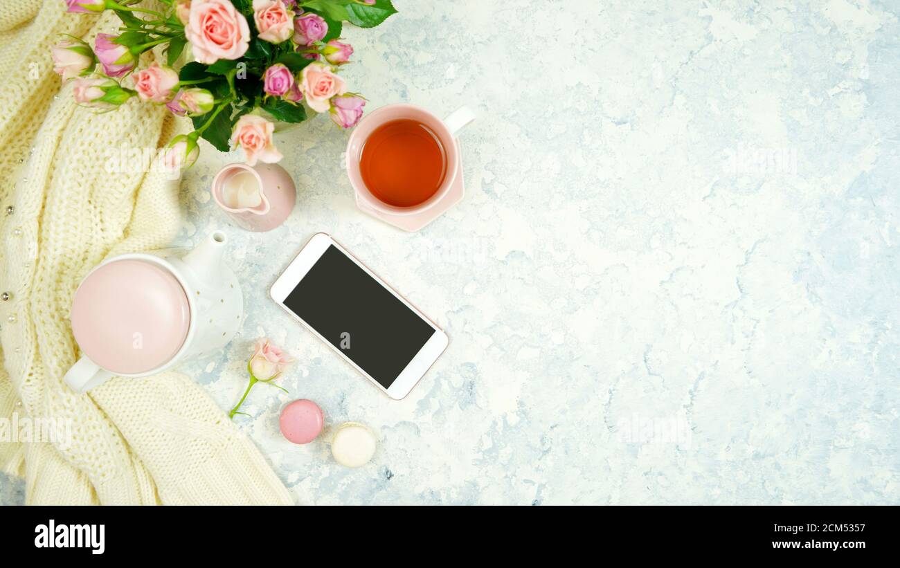 Blush pink theme cosy hygge desktop workspace with keyboard smart phone ...