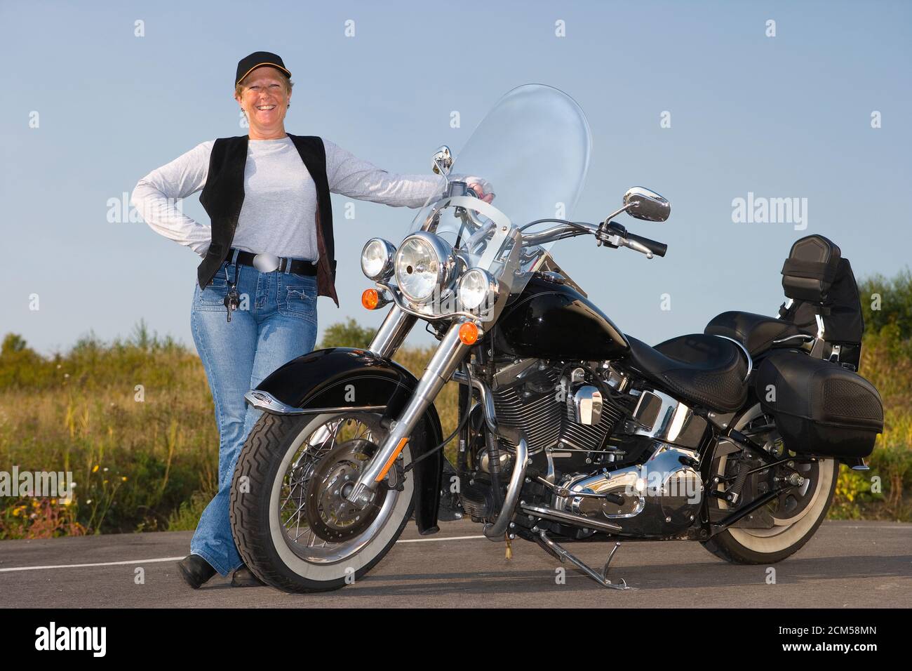 Woman posing with her motorcycle Stock Photo - Alamy