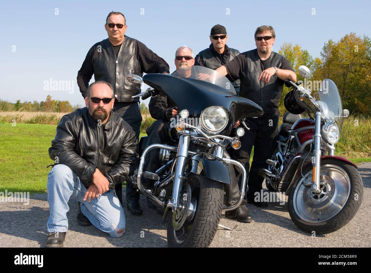 Biker group posing with their motorcycles Stock Photo - Alamy
