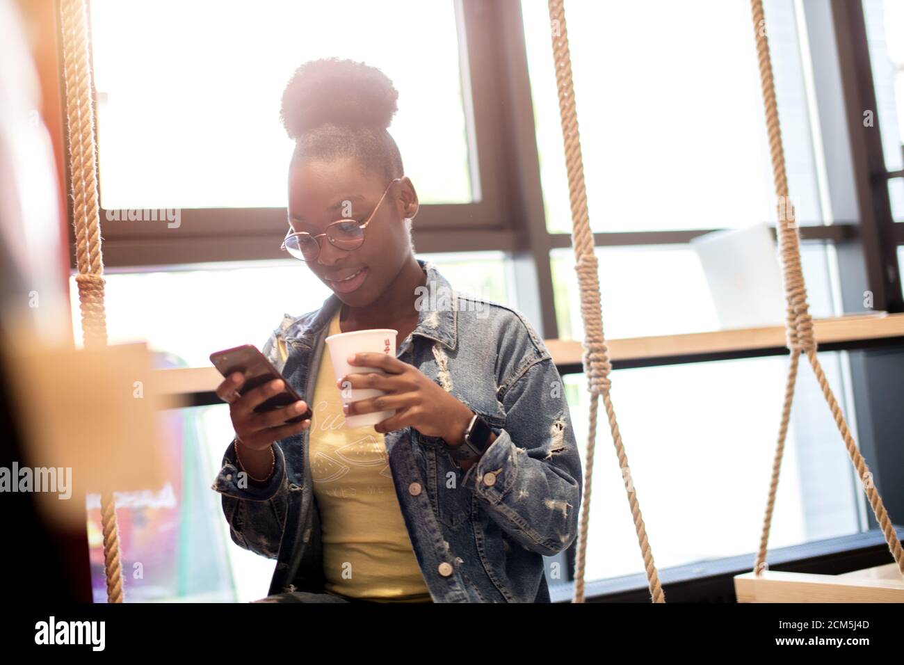 Hipster dark-skinned woman with Afro hairstyle, dressed casually ... Hipster dark-skinned woman with Afro hairstyle, dressed casually ...