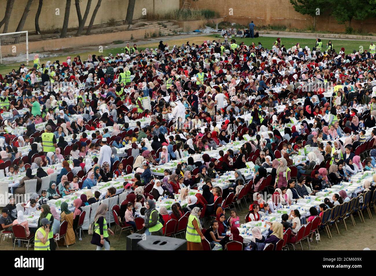 Orphans wait for their iftar meal during Jordan's largest charity event ...