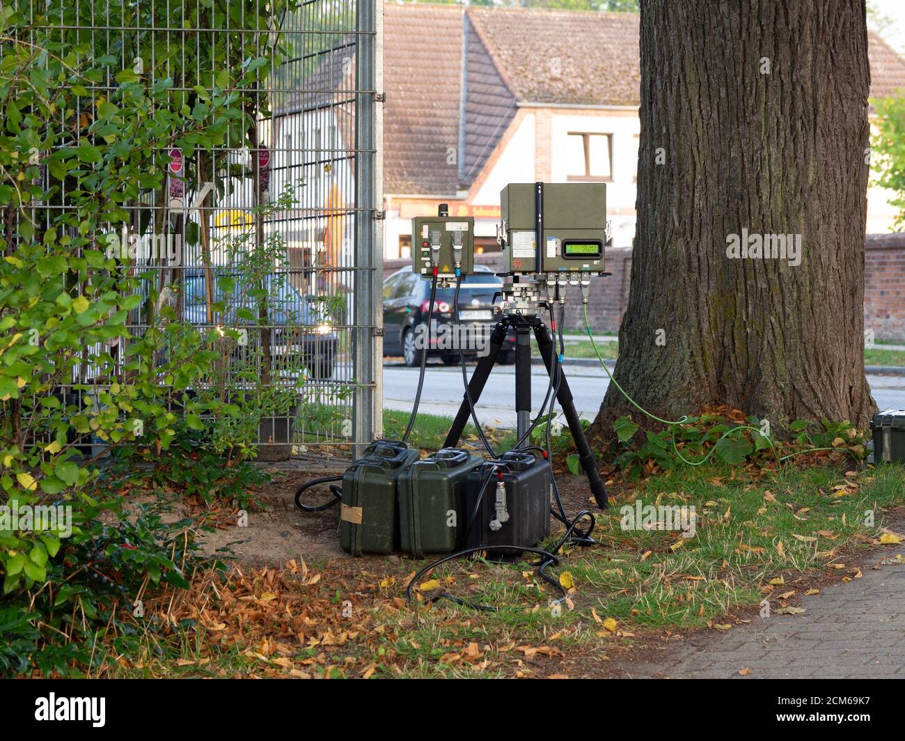 behind a tree is a radar trap for speed monitoring Stock Photo - Alamy