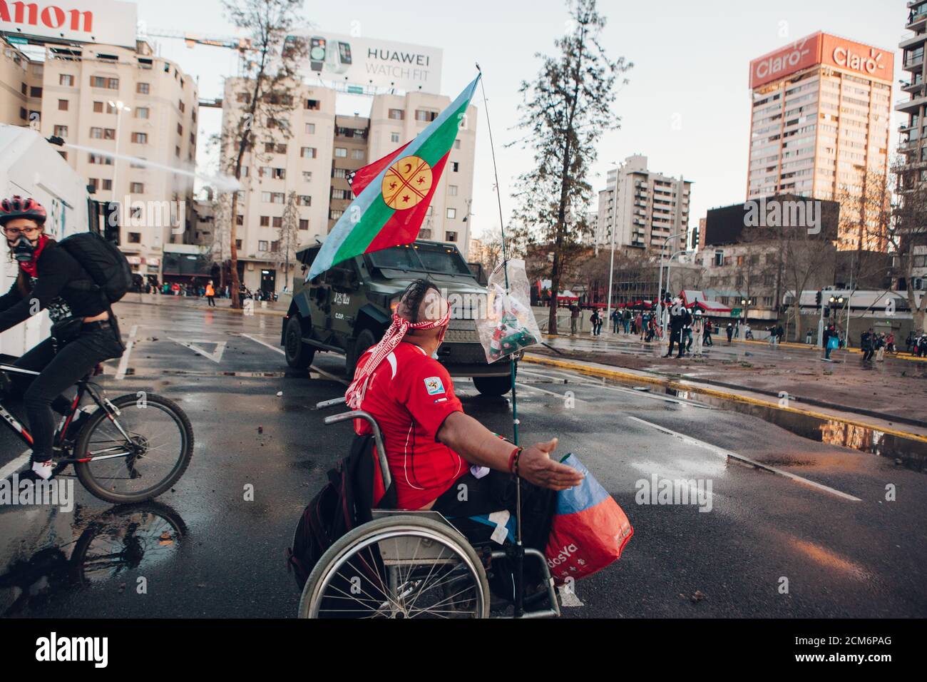 SANTIAGO, CHILE - SEPTEMBER 11, 2020 - Man in a wheelchair, with a ...