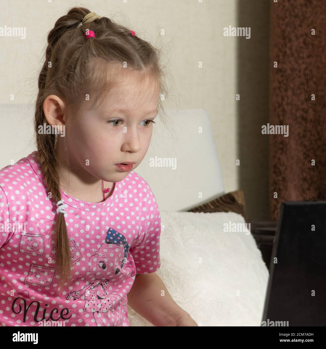 Distance learning online education. Schoolgirl studying at home with ...