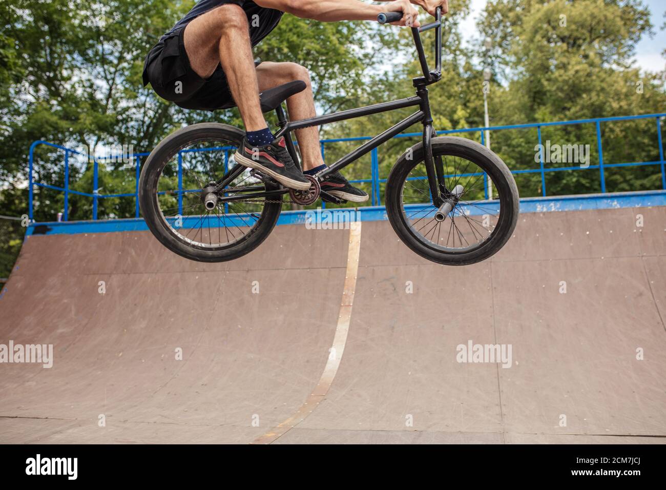 Table top in skatepark, bmx bike trick on pipe Stock Photo - Alamy