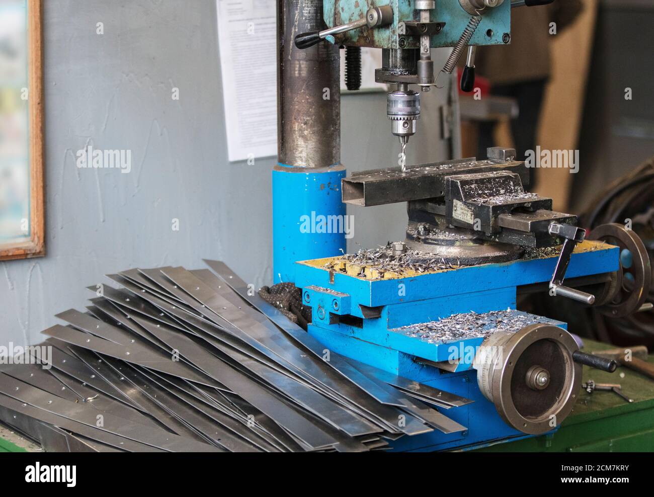 Industrial drilling machine drills a hole in the metal. Metal ...