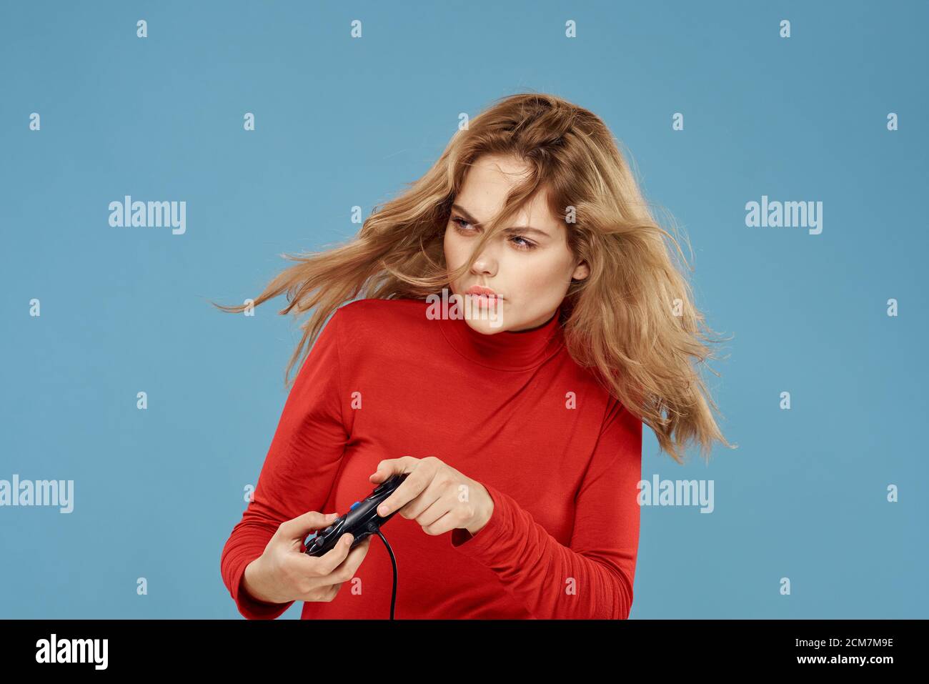 Pretty woman gamepad in hands playing games entertainment consoles to ...