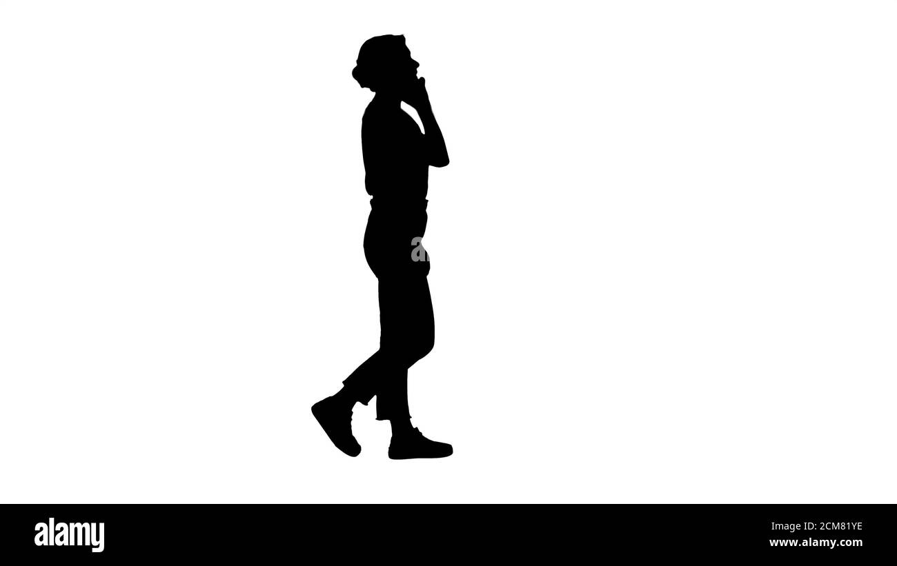 Silhouette Beautiful young girl having a phone call walking Stock Photo ...