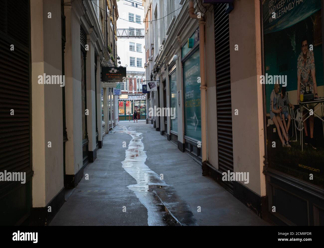 A long puddle in the middle of a narrow street in London, UK Stock ...