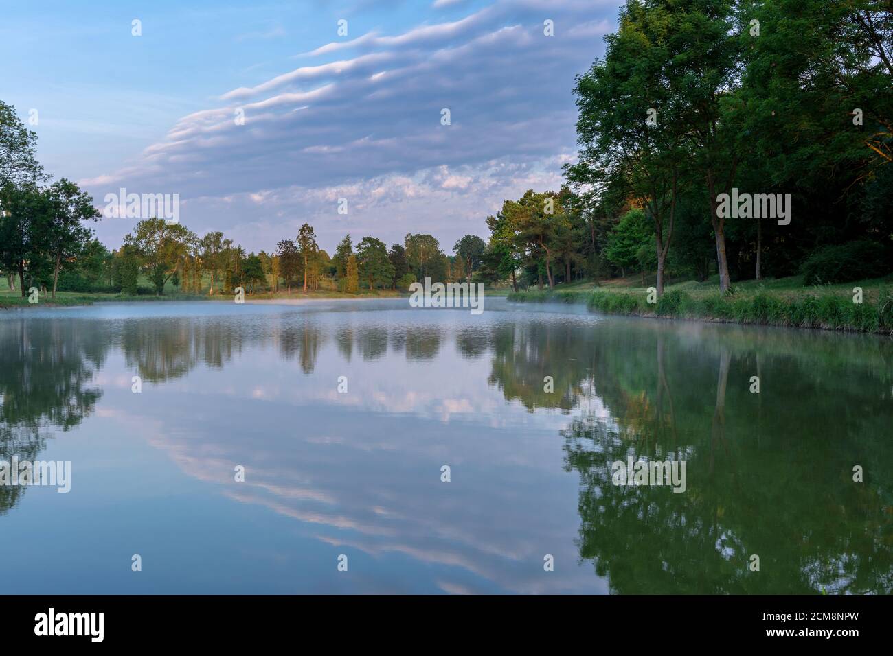 French countryside - Lorraine. Panorama of a small lake with trees in ...