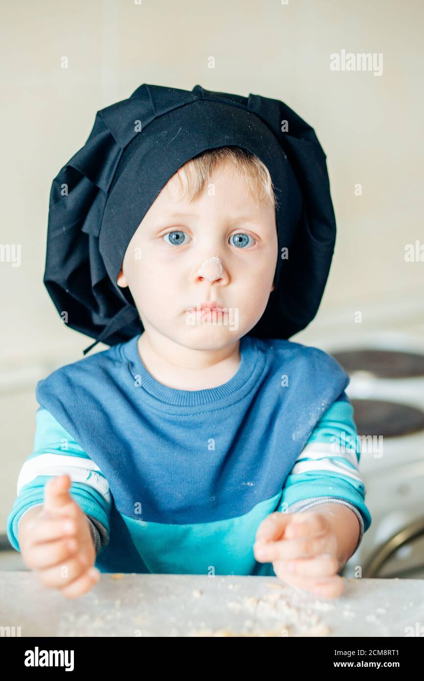 Cute boy cooking in kitchen at home Stock Photo - Alamy