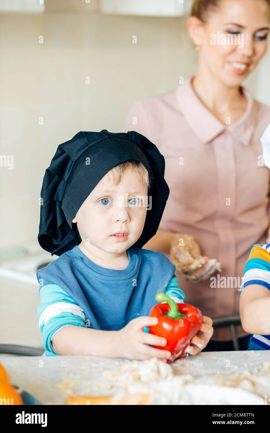 Cute boy cooking in kitchen at home Stock Photo - Alamy