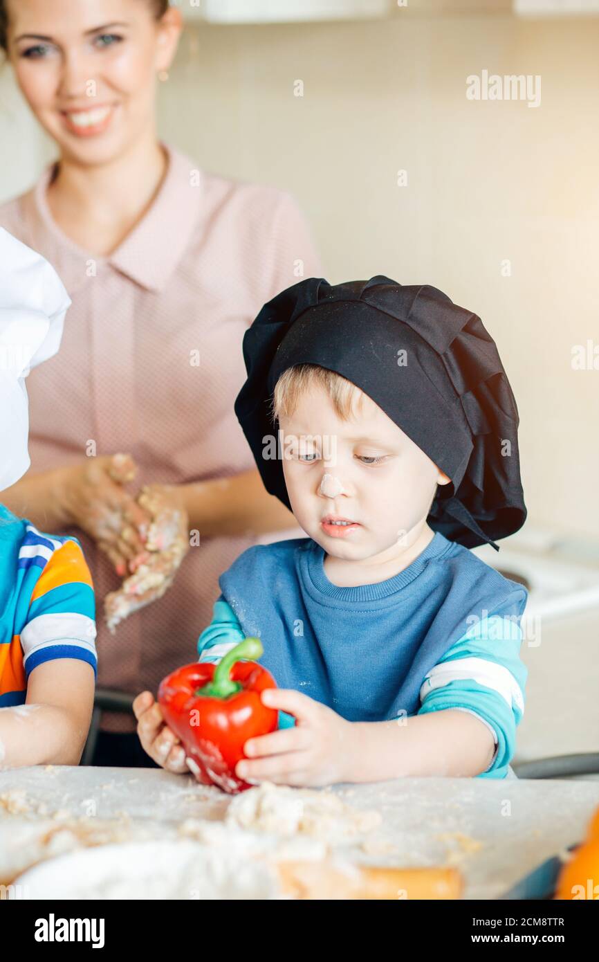 Cute boy cooking in kitchen at home Stock Photo - Alamy