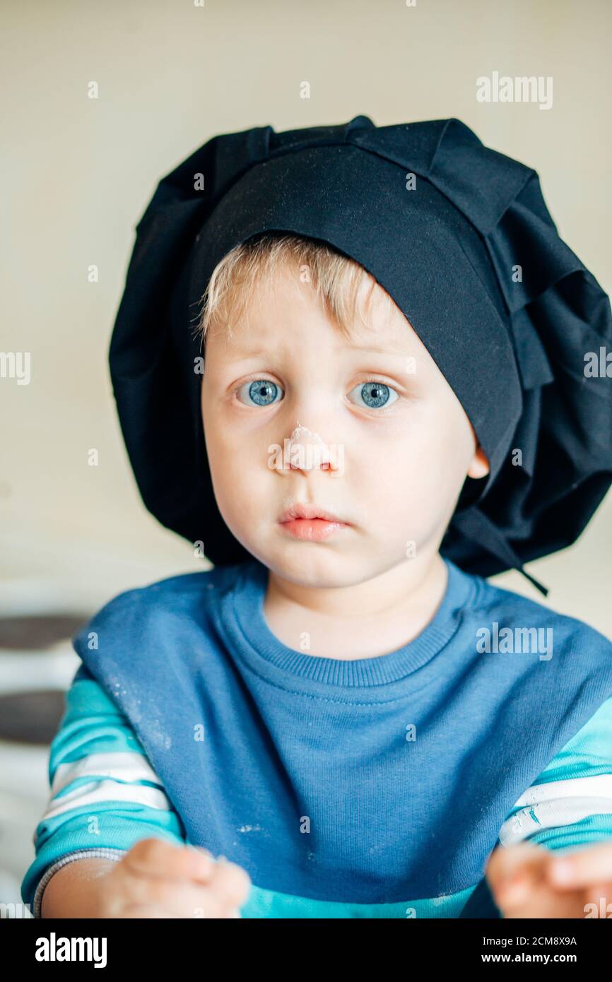Cute boy cooking in kitchen at home Stock Photo - Alamy