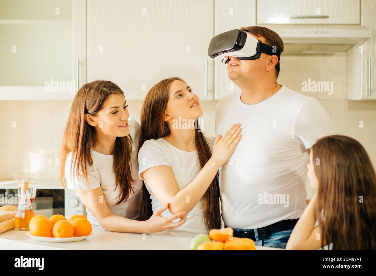 Happy family having fun together in virtual reality headsets Stock ...