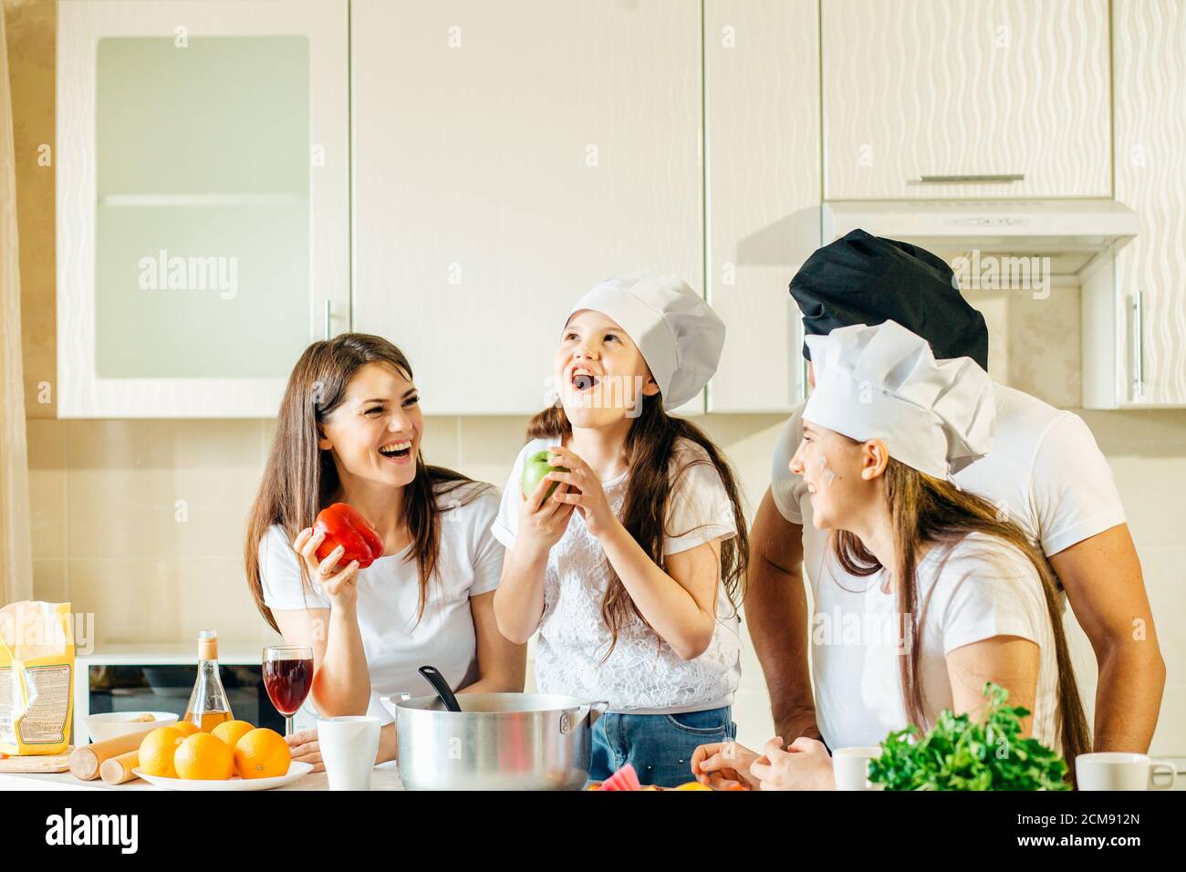 Shocked daughter cooking at kitchen. Surprised family at kitchen Stock ...