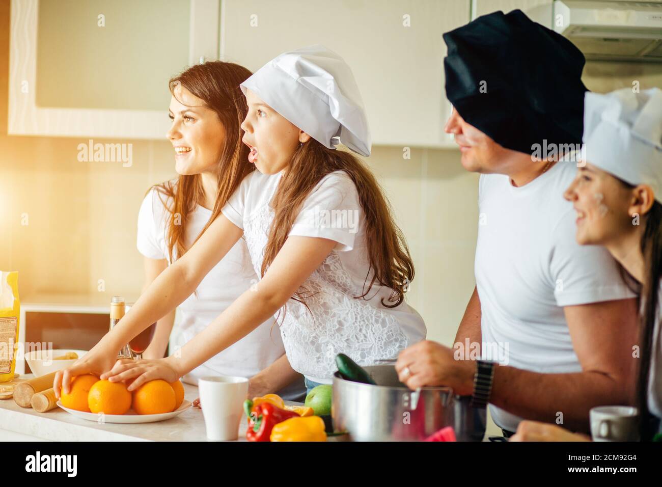 Shocked daughter cooking at kitchen. Surprised family at kitchen Stock ...