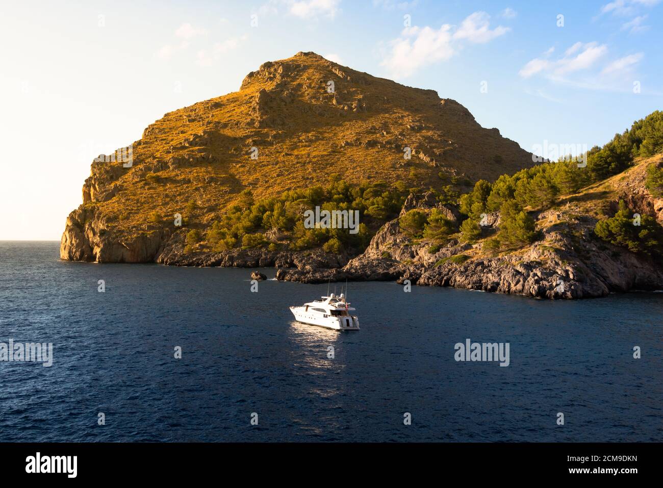 Stunning mediterranean beach scenery with a luxury boat and a ...