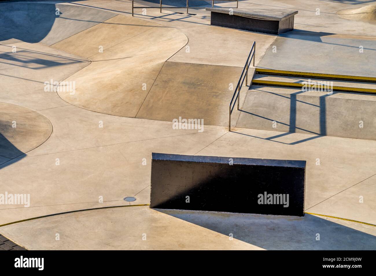 Empty skatepark, skateboarding park in city at sunny day Stock Photo ...