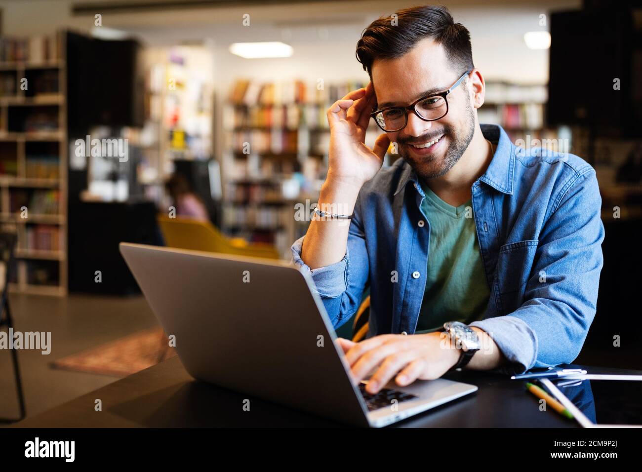 Happy man working on laptop. Technology people work study concept Stock ...