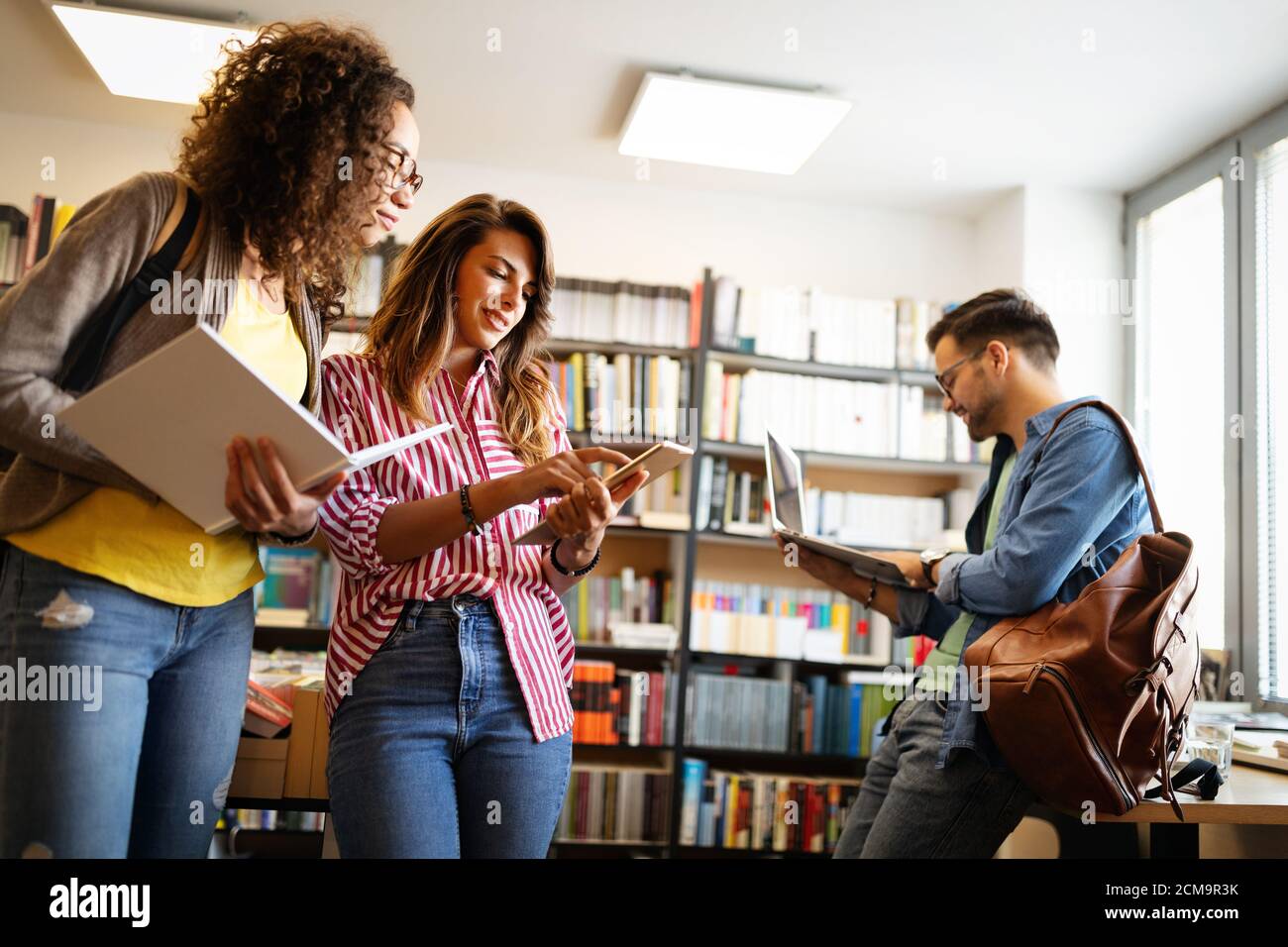 Group of students study at library. Learning and preparing for ...