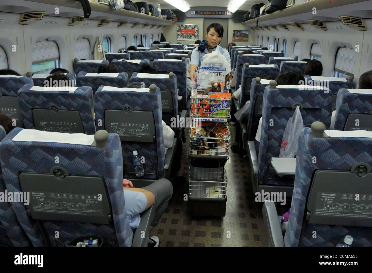 A STEWARDESS WITH TROLLEY INSIDE A SHINKANSEN TRAIN VAGON Stock Photo ...