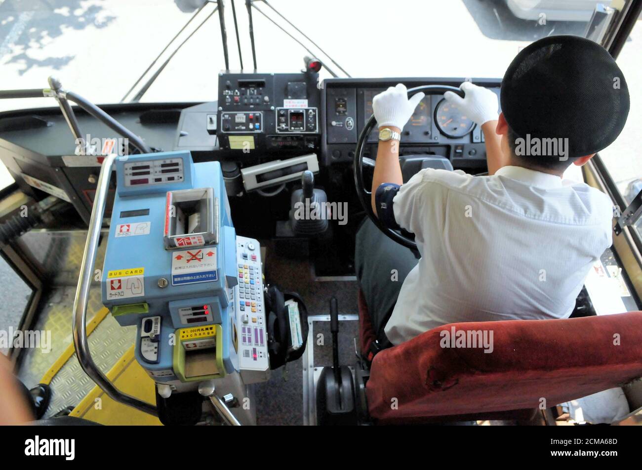 A DRIVER DRIVING A PUBLIC BUS Stock Photo - Alamy